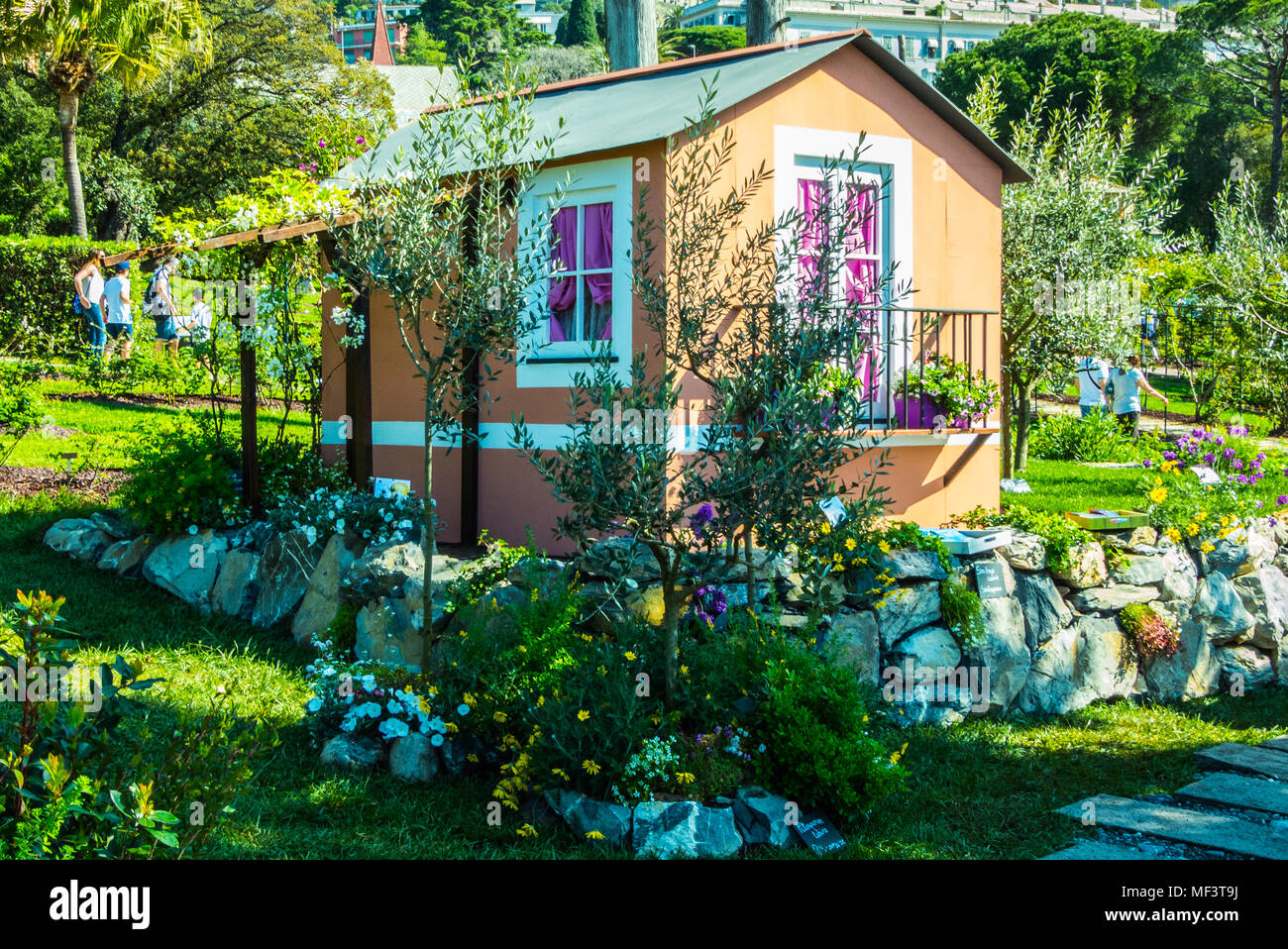Orange little house in the garden Stock Photo - Alamy