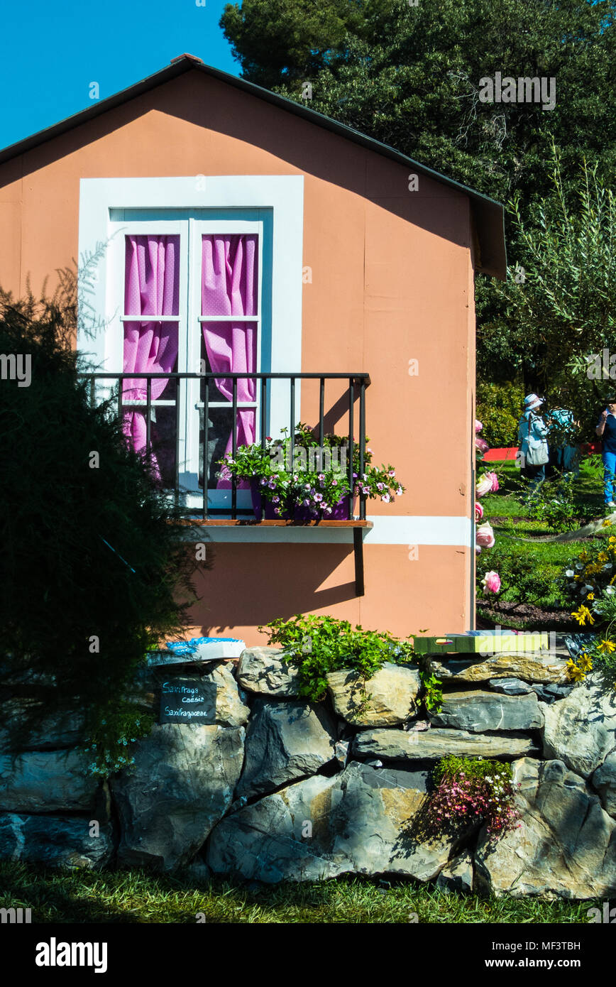 Orange little house in the garden Stock Photo - Alamy