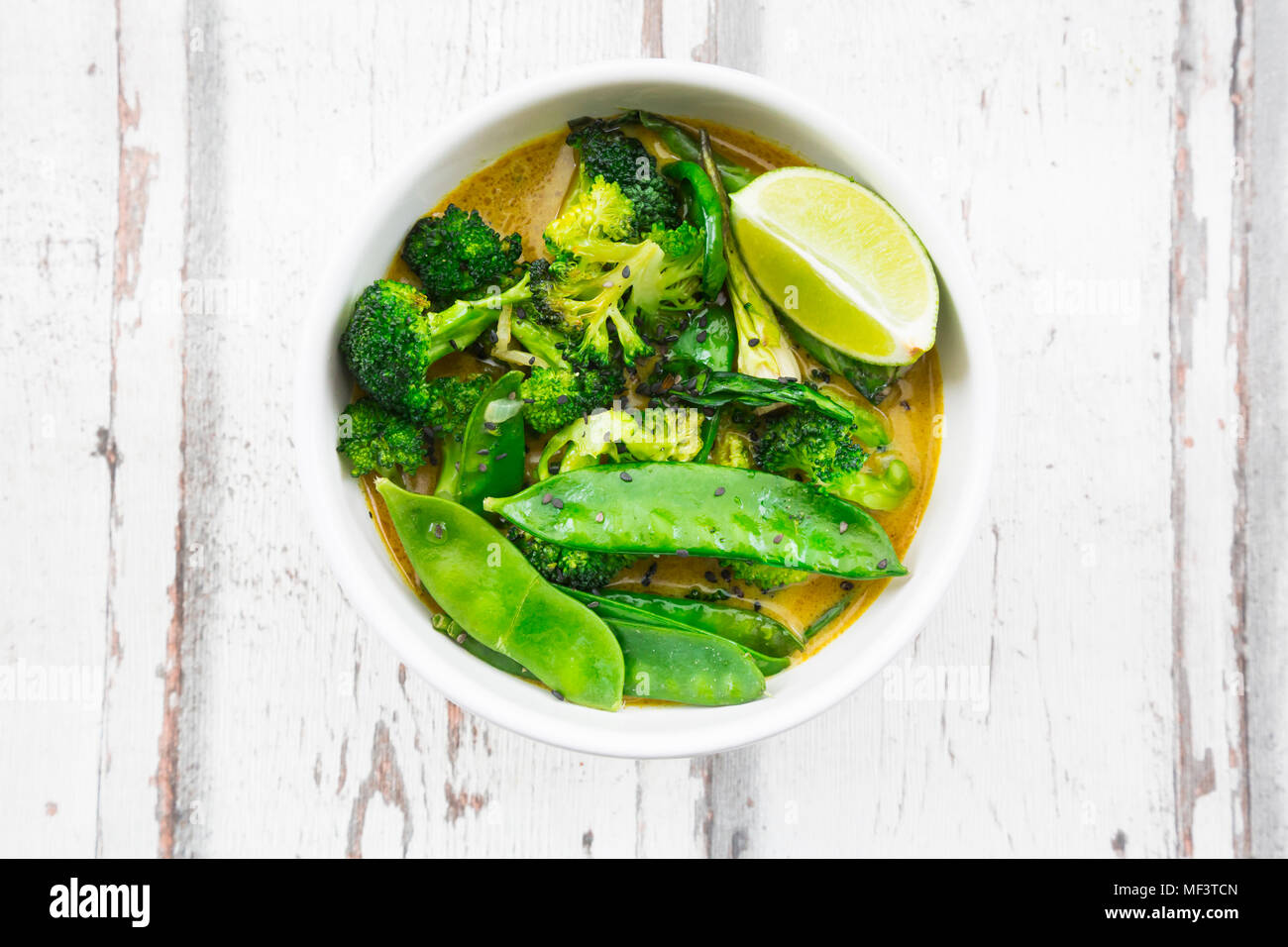 Green thai curry with broccoli, pak choi, snow peas, baby spinach, lime ...
