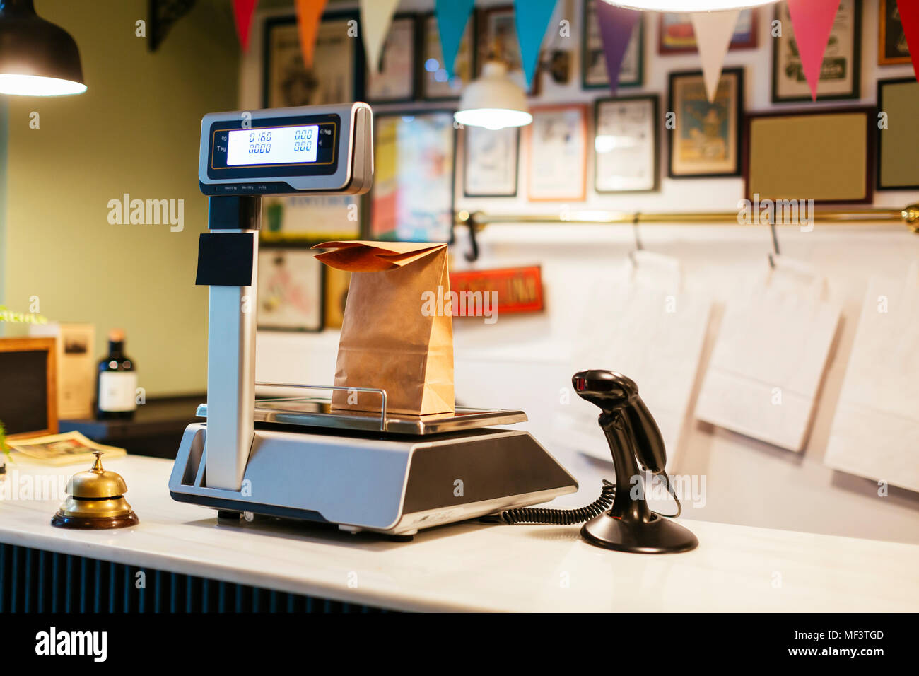 Paper bag on scale at counter of a store Stock Photo - Alamy