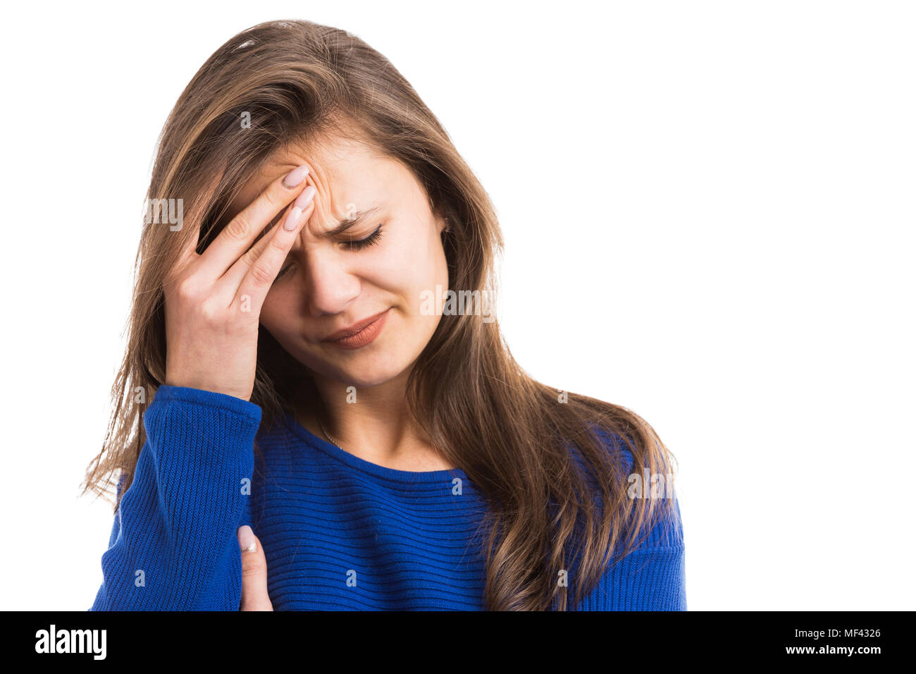 Young woman feeling strong head ache rubbing painful forehead as ...