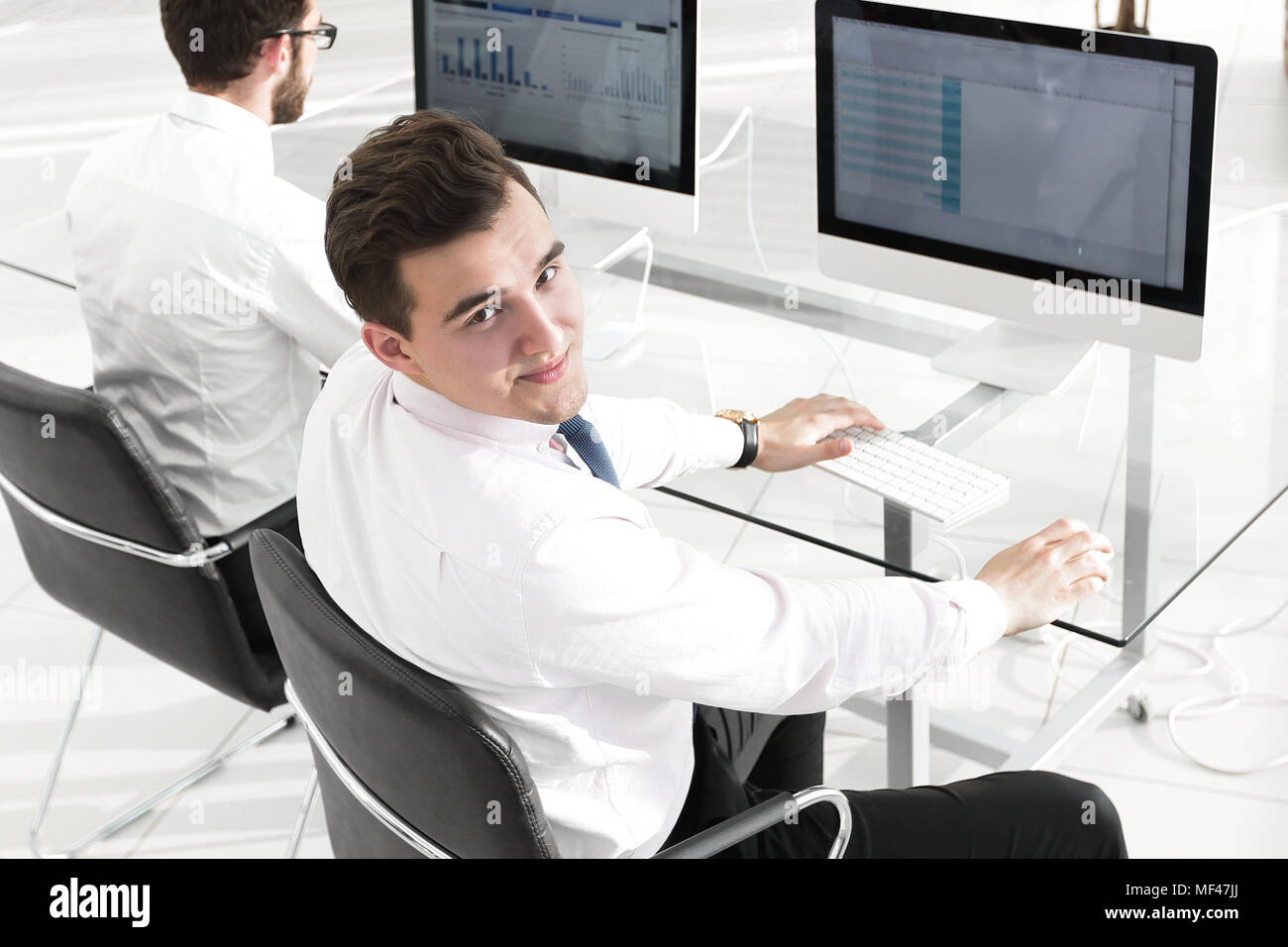 Boss sitting behind desk employees hi-res stock photography and images ...