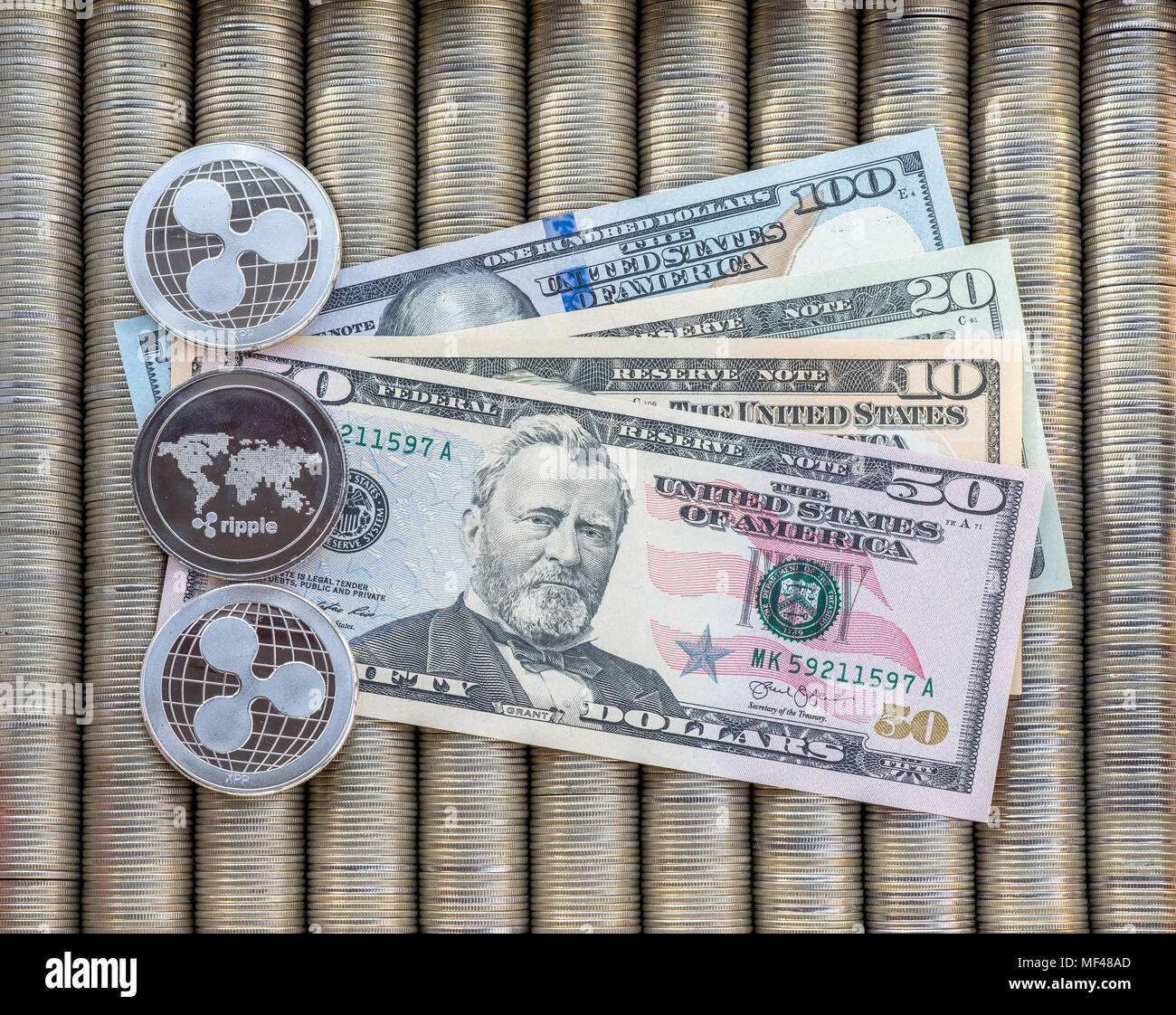 Silver crypto coins Ripple XRP, paper notes us dollars. Metal coins are ...