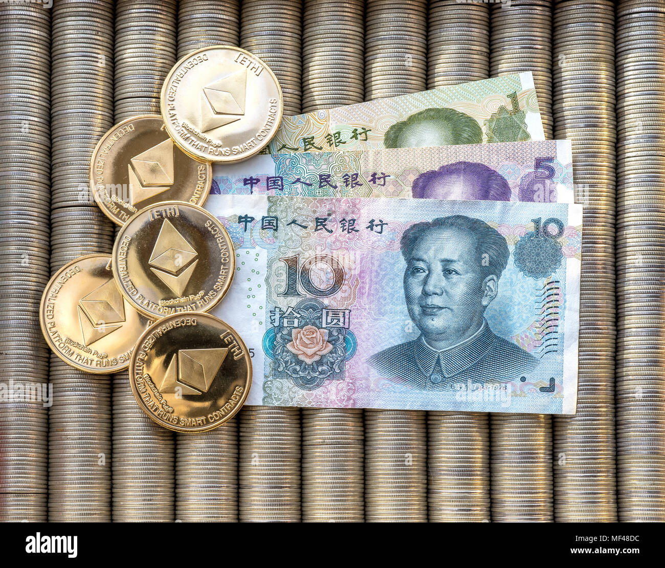 Gold crypto coins Ethereum ETH, paper denominations Chinese yuan. Metal ...