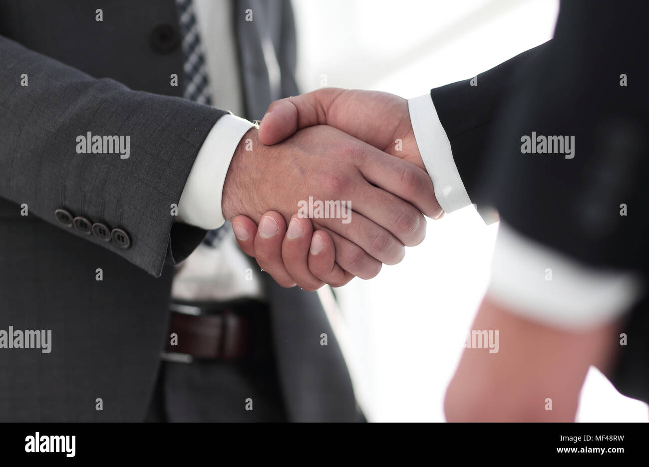 Businessman giving his hand for handshake to partner Stock Photo - Alamy