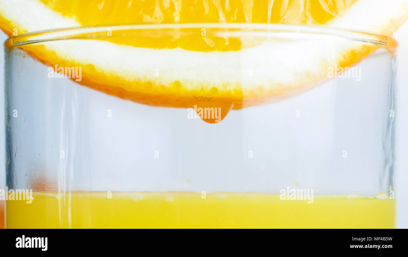 Closeup image of juice droplet on side of orange slice Stock Photo - Alamy