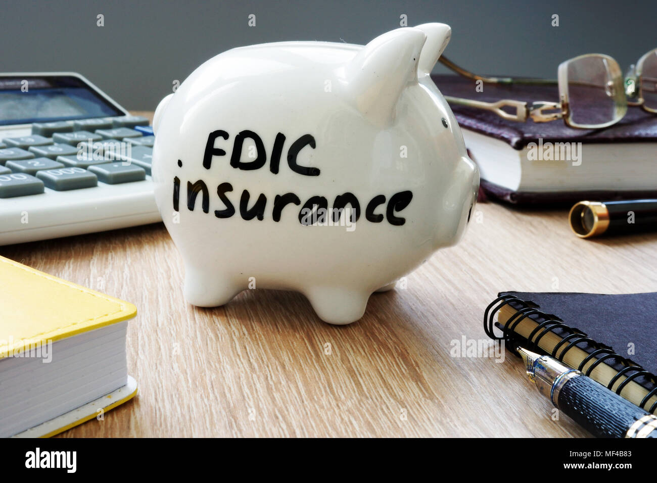 FDIC insurance policy on an office desk Stock Photo - Alamy