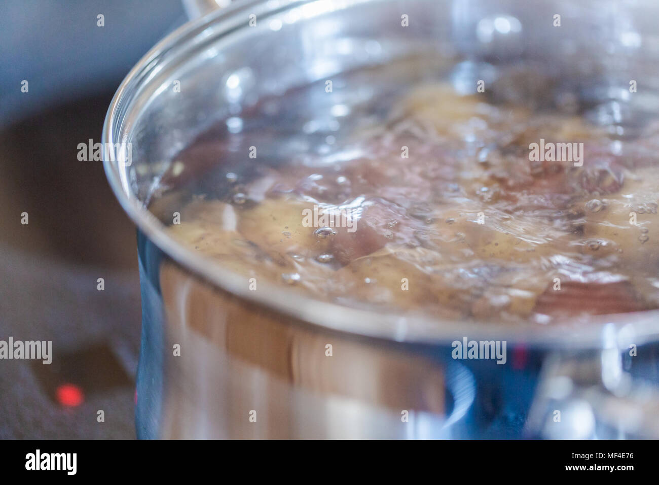 Boiling little gold and red potatoes in large cooking pot Stock Photo ...