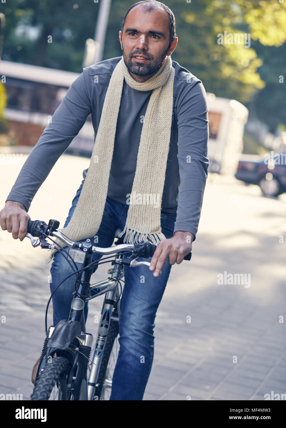Man riding bike outdoors Stock Photo - Alamy
