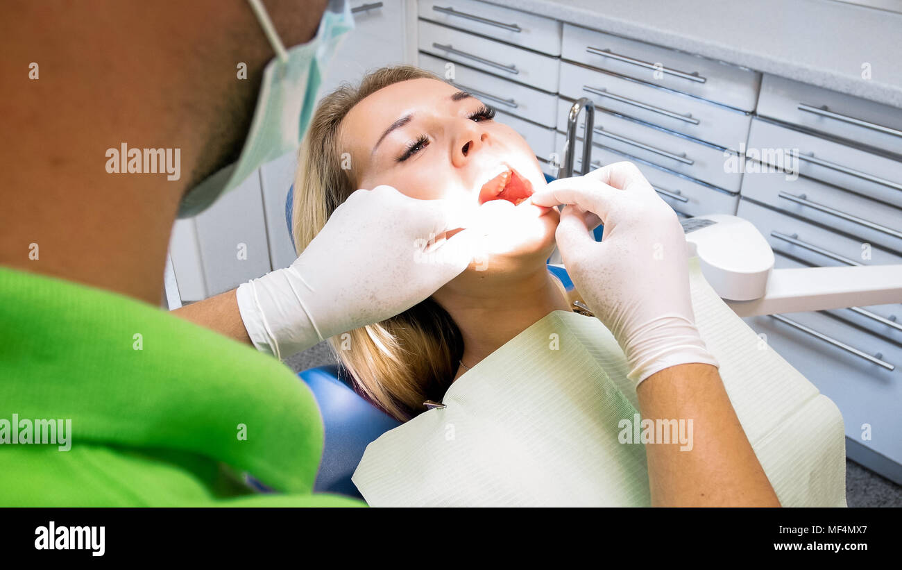 Closeup image of young woman open mouth for theeth checkup Stock Photo ...