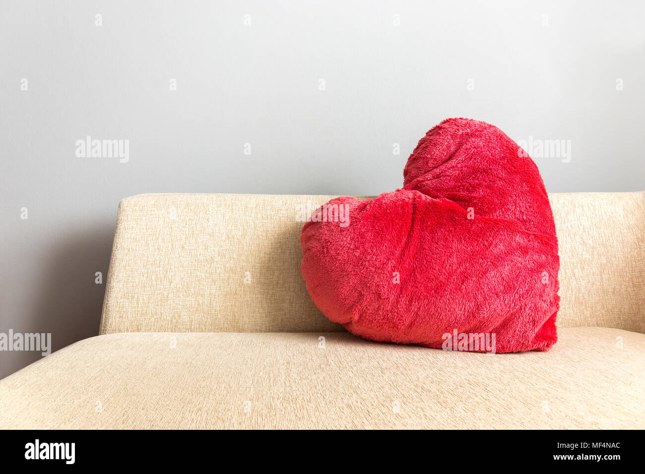 pillow red heart or love shape on sofa Stock Photo - Alamy