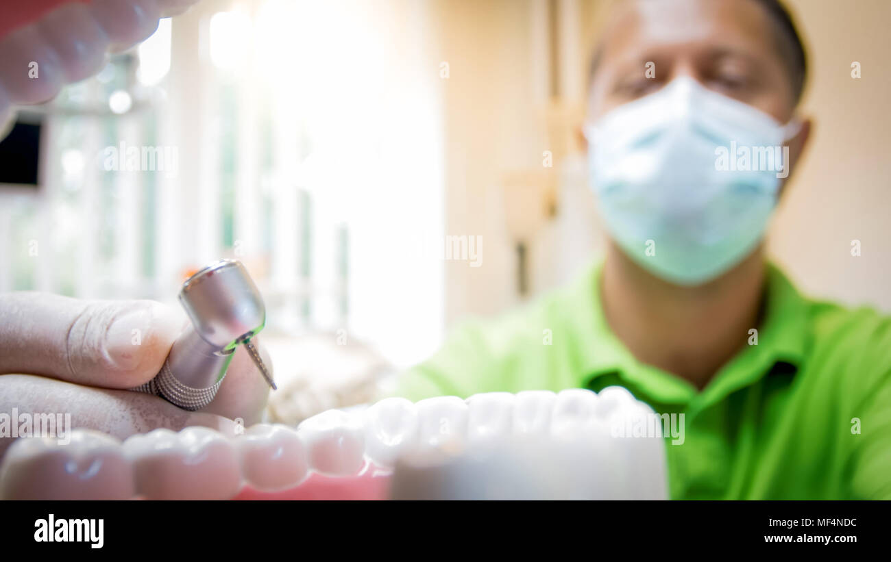 Dentist using dental instruments hi-res stock photography and images ...