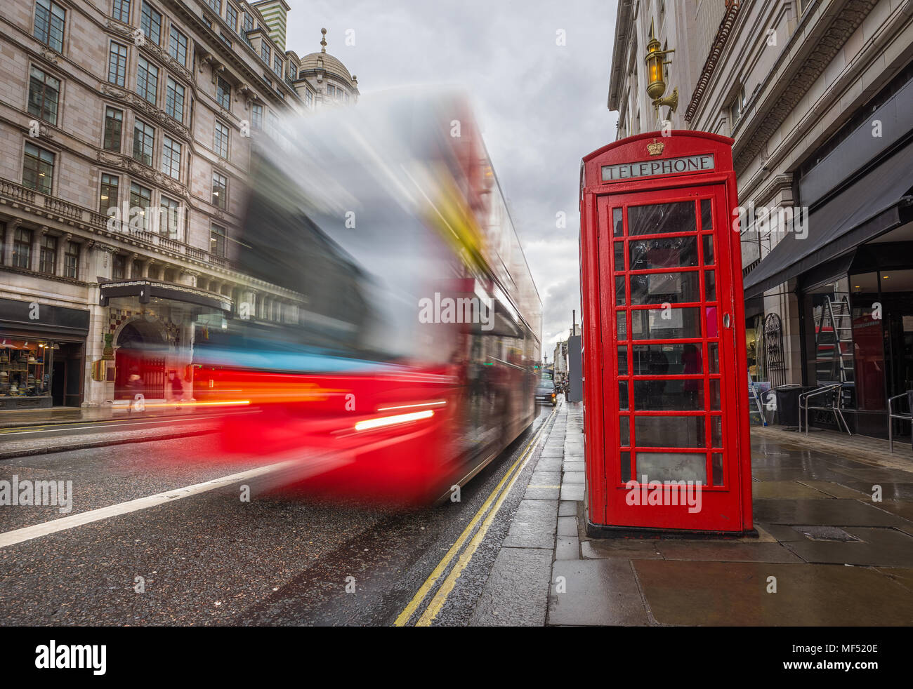 London, England - Iconic blurred red double-decker bus on the move with ...