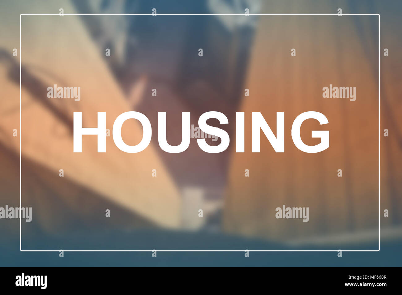 Housing word with blurring buildings background Stock Photo - Alamy