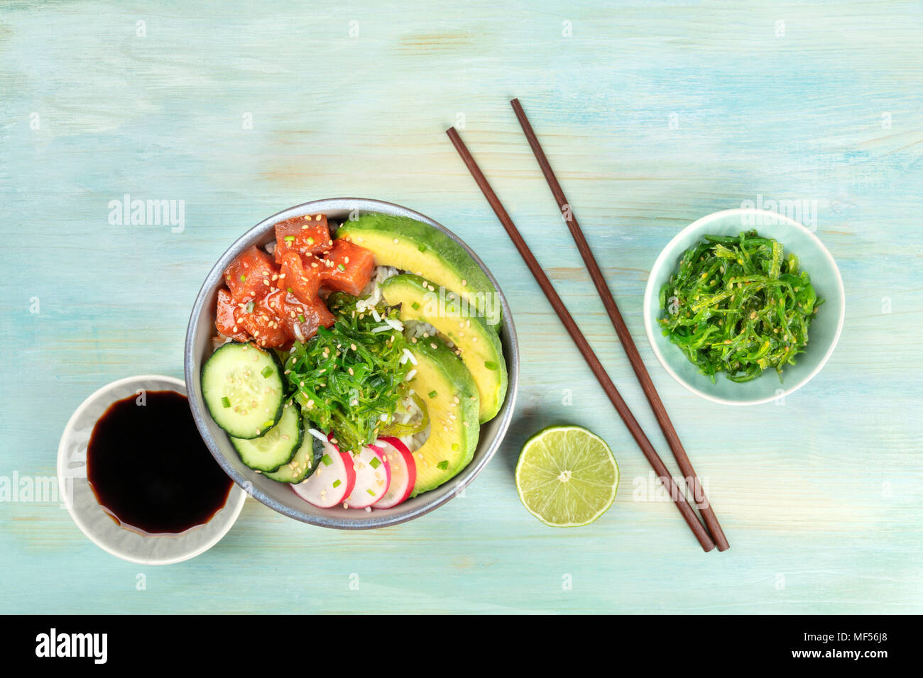 An overhead photo of poke, traditional Hawaiian raw fish salad, with a ...
