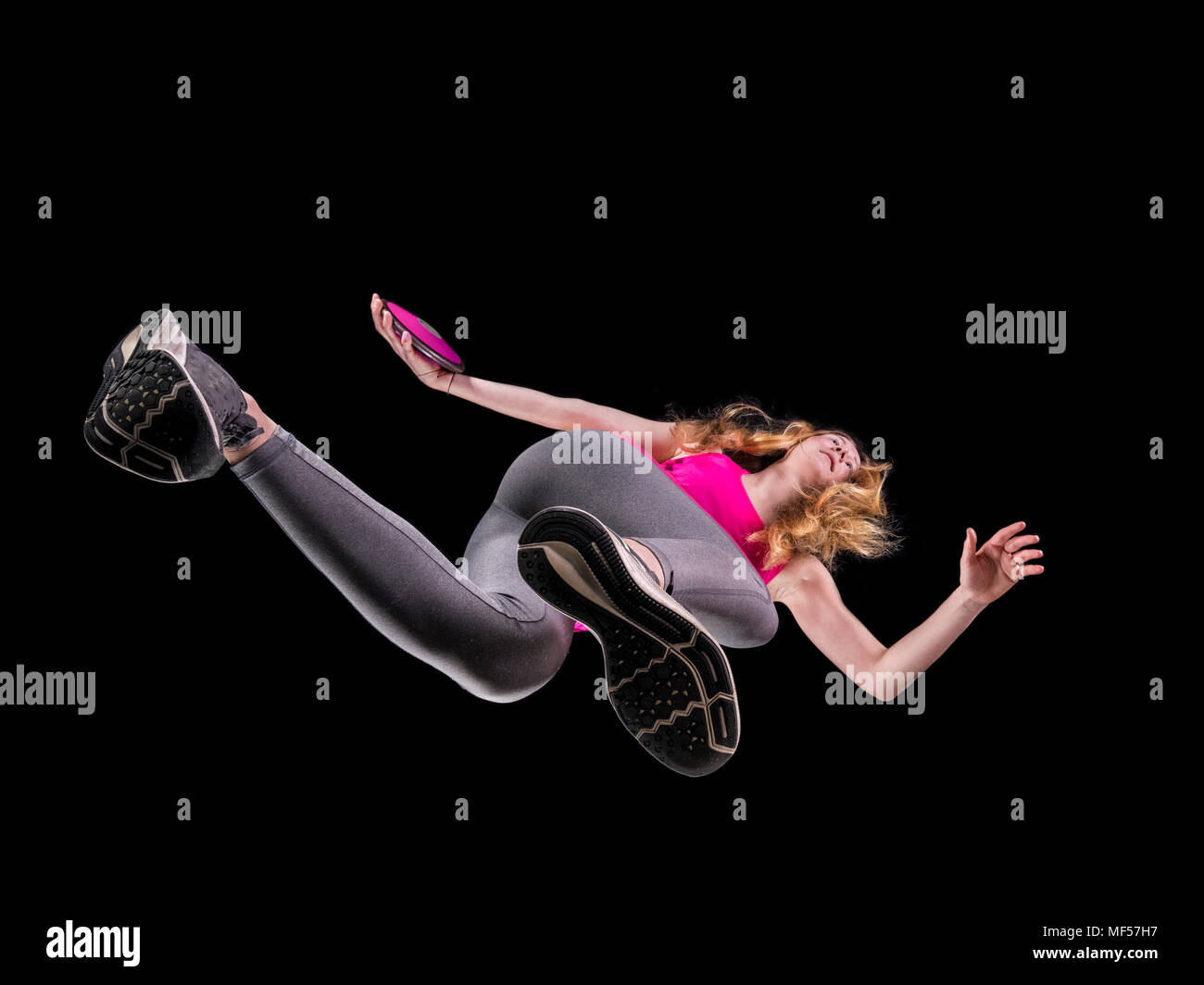 Discus thrower against black background seen from below Stock Photo - Alamy