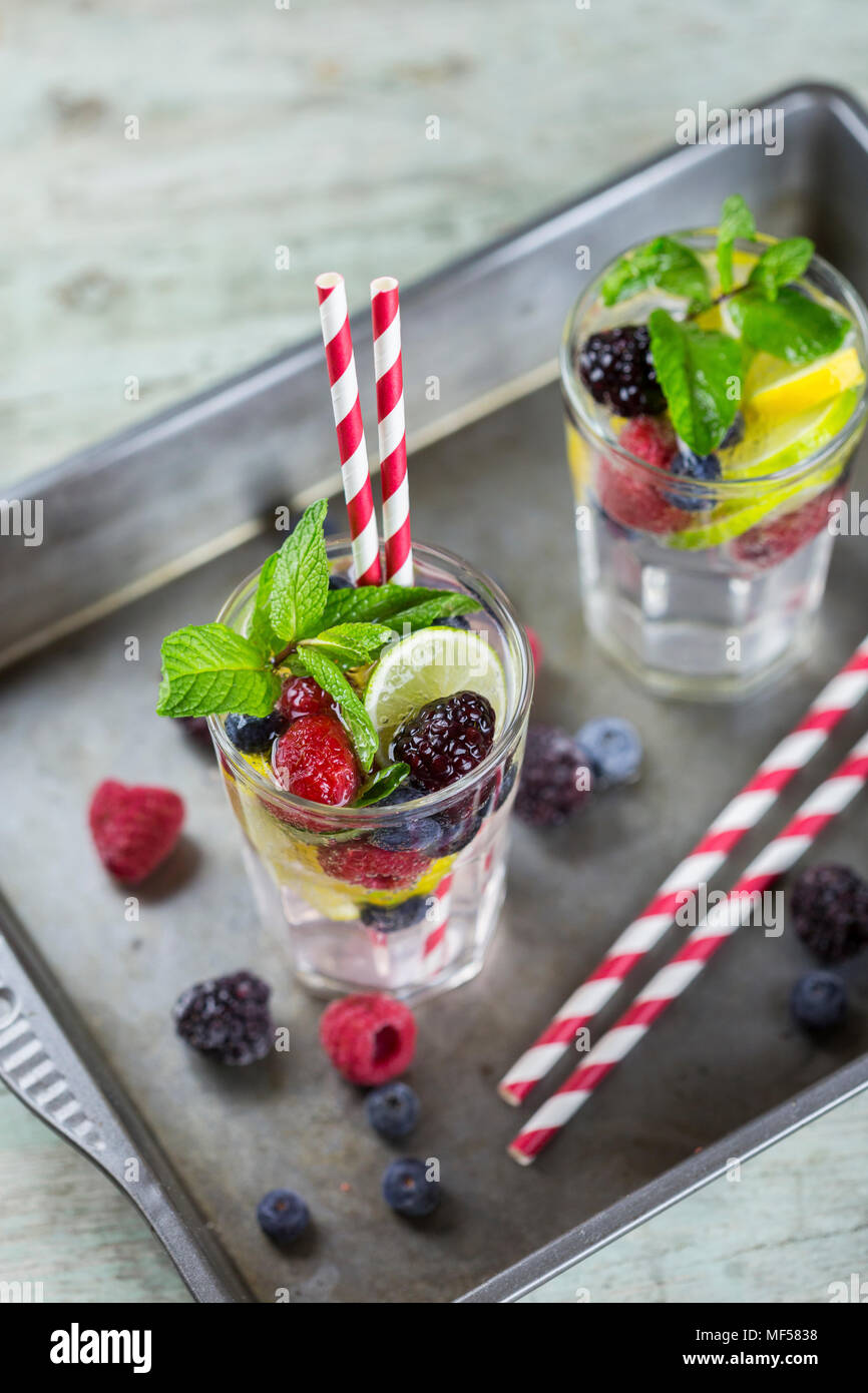 Infused water with fresh berries, raspberry, blueberry, blackberry ...
