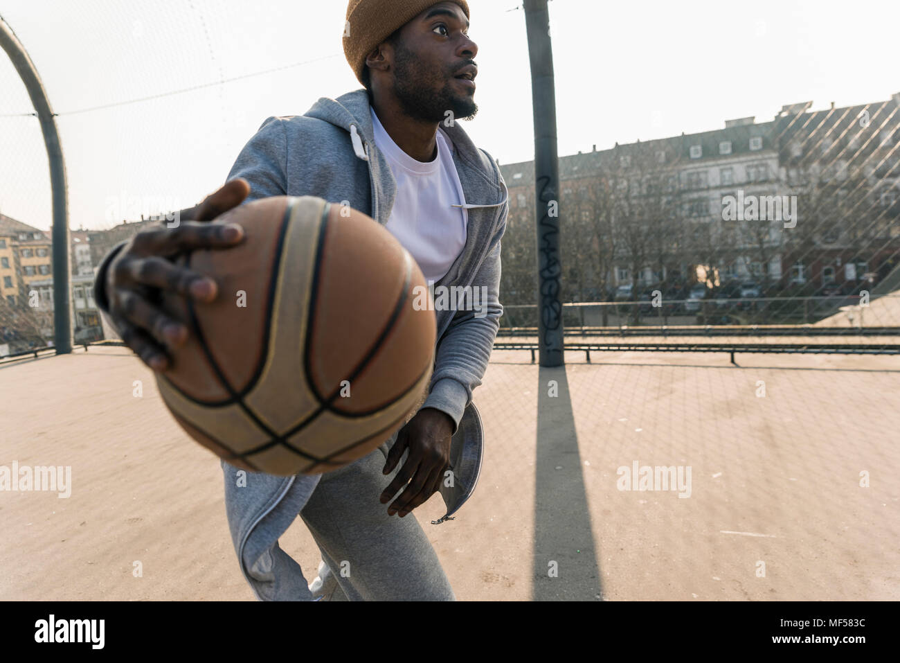 Basketball player in action on court Stock Photo - Alamy