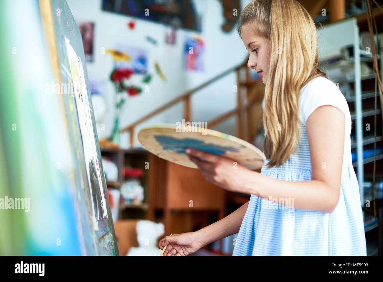 Girl Painting in Art Class Stock Photo - Alamy