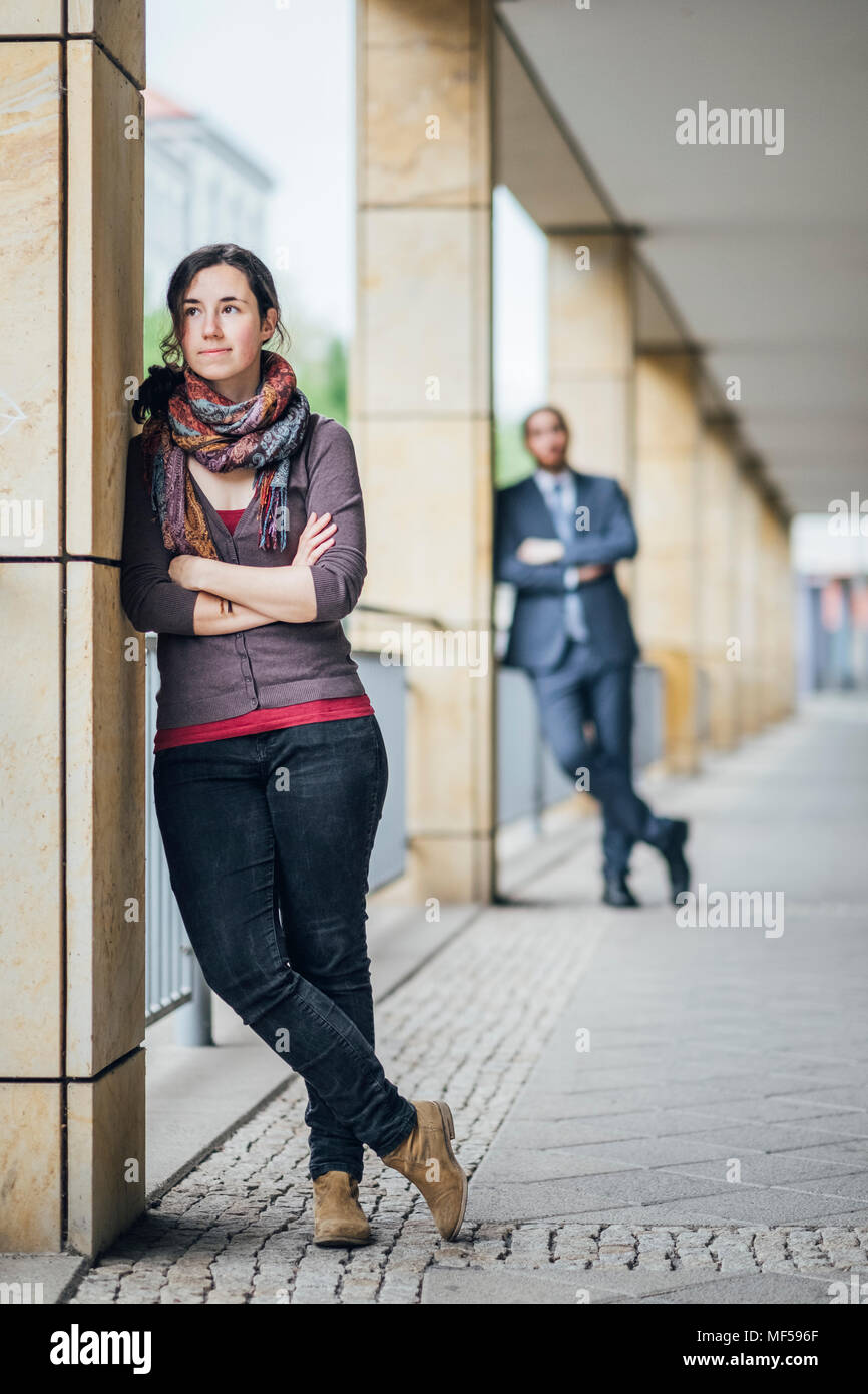 Man and woman standing sideways hi-res stock photography and images - Alamy