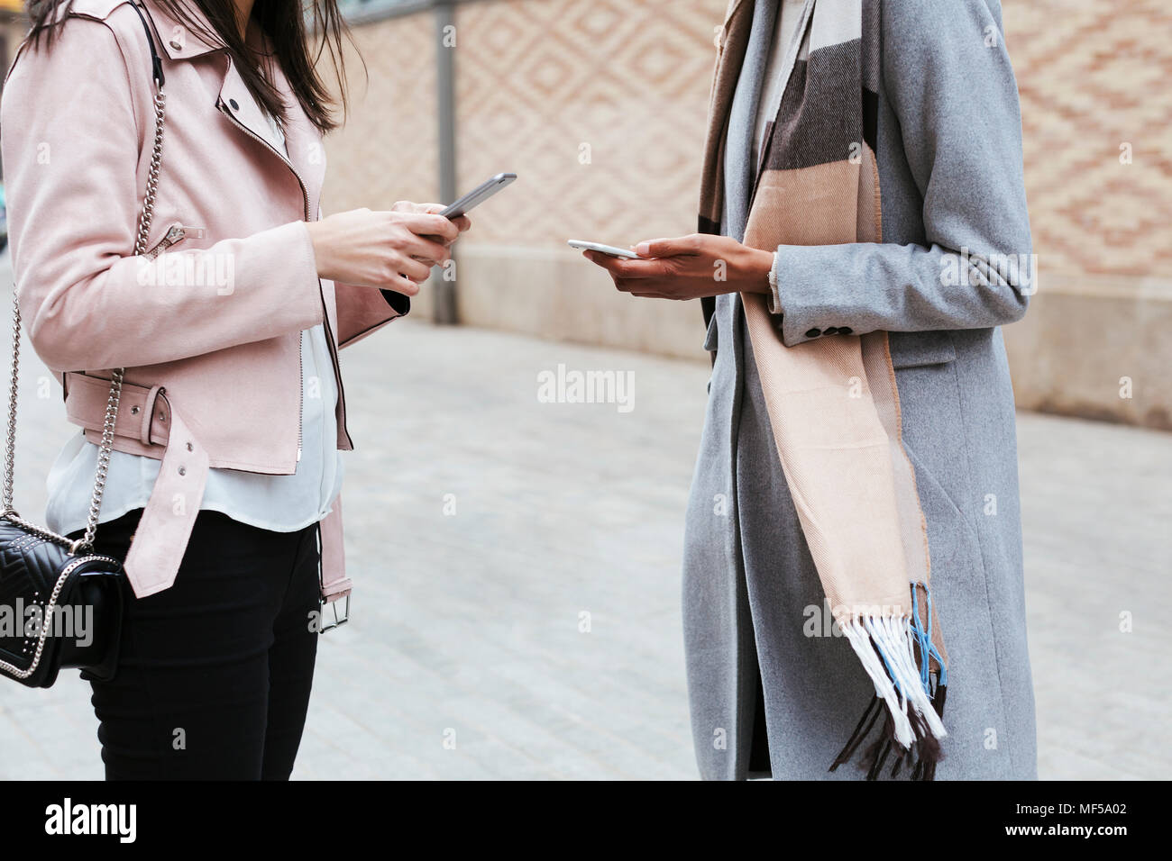 Using two phones hi-res stock photography and images - Alamy