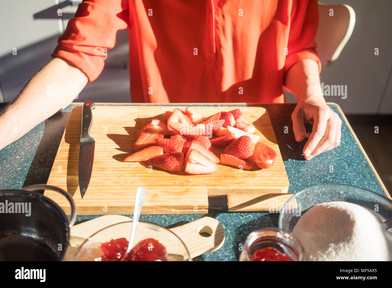 Woman making jam in kitchen hi-res stock photography and images - Alamy