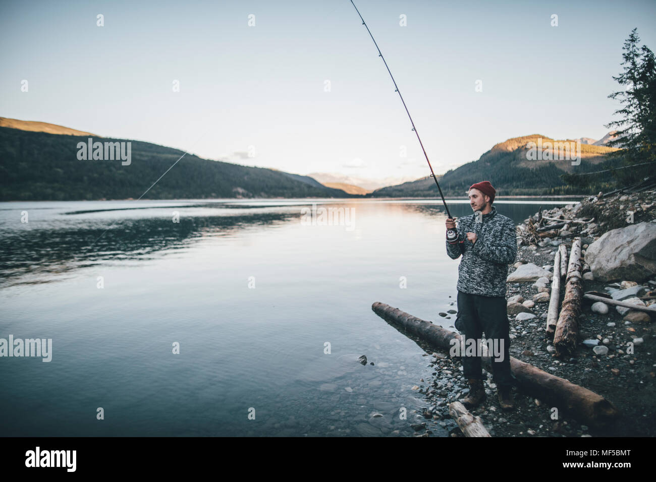 Man fishing at kinbasket lake hi-res stock photography and images - Alamy