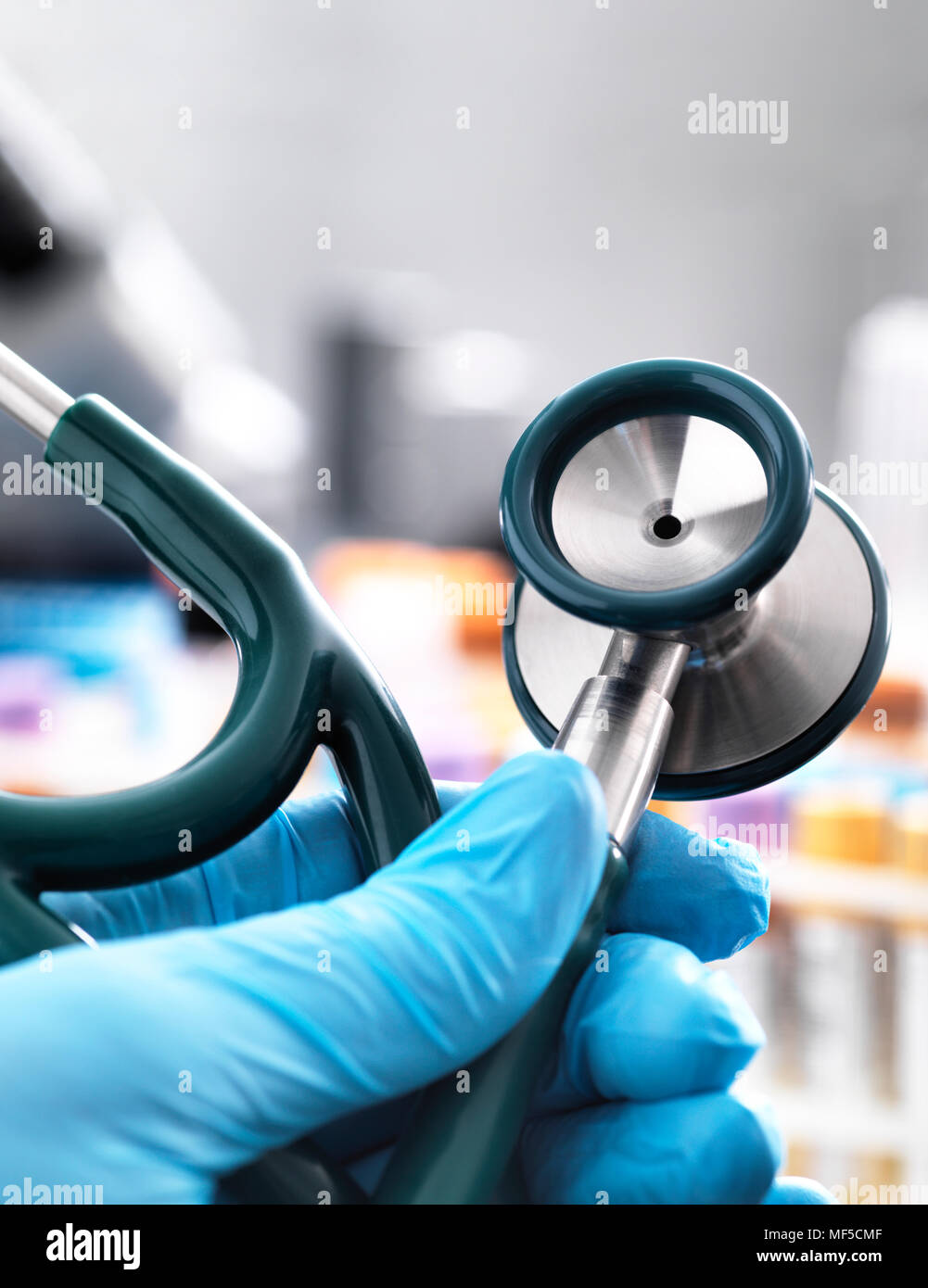 Doctor holding a stethoscope hi-res stock photography and images - Alamy