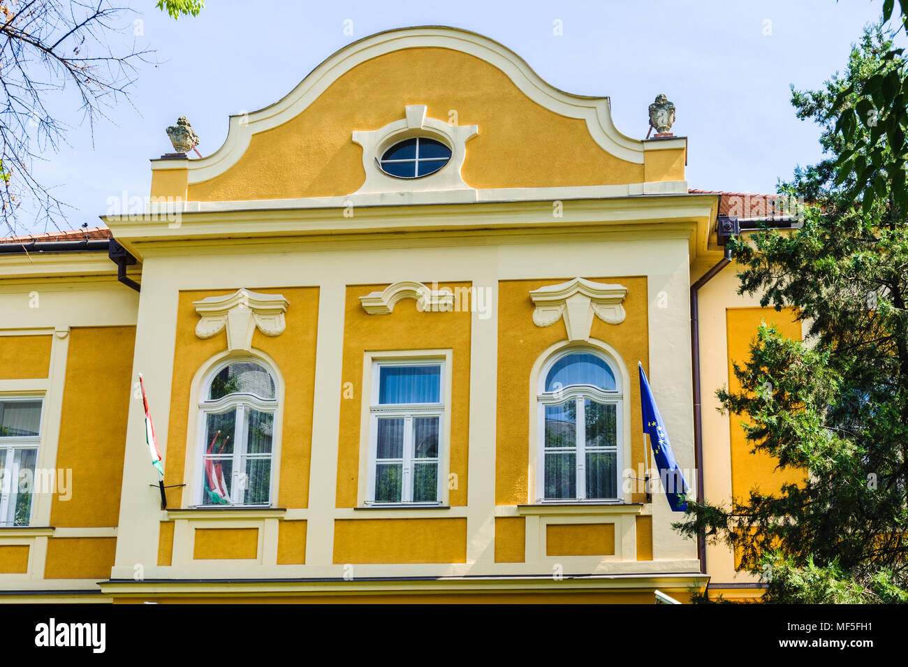 Yellow living house in Eger, Hungary Stock Photo - Alamy