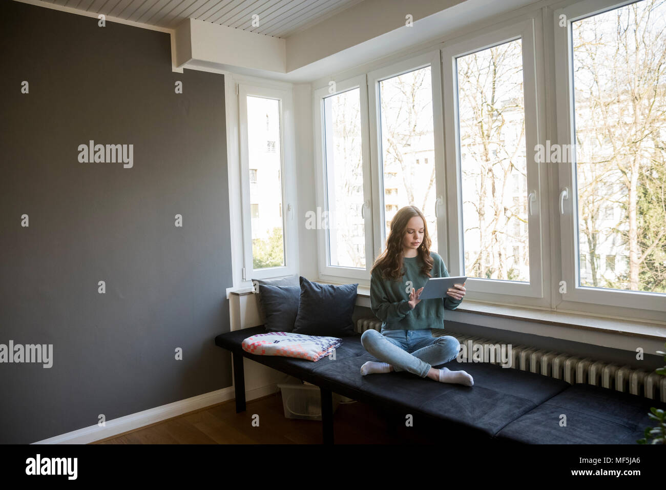 Teenage girl using digital tablet Stock Photo - Alamy