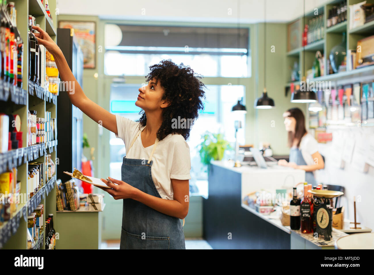 Woman product shelf hi-res stock photography and images - Alamy