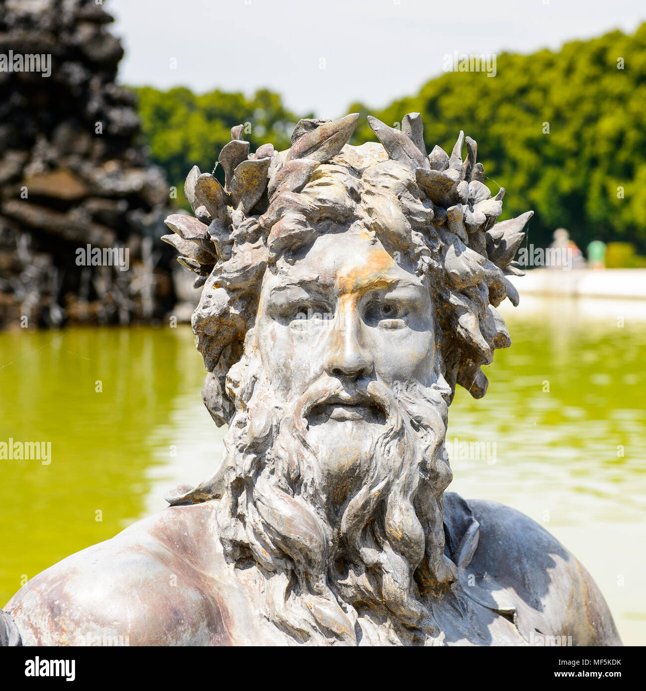 Statue of the fountain in front of the Herrenchiemsee Palace , one of ...