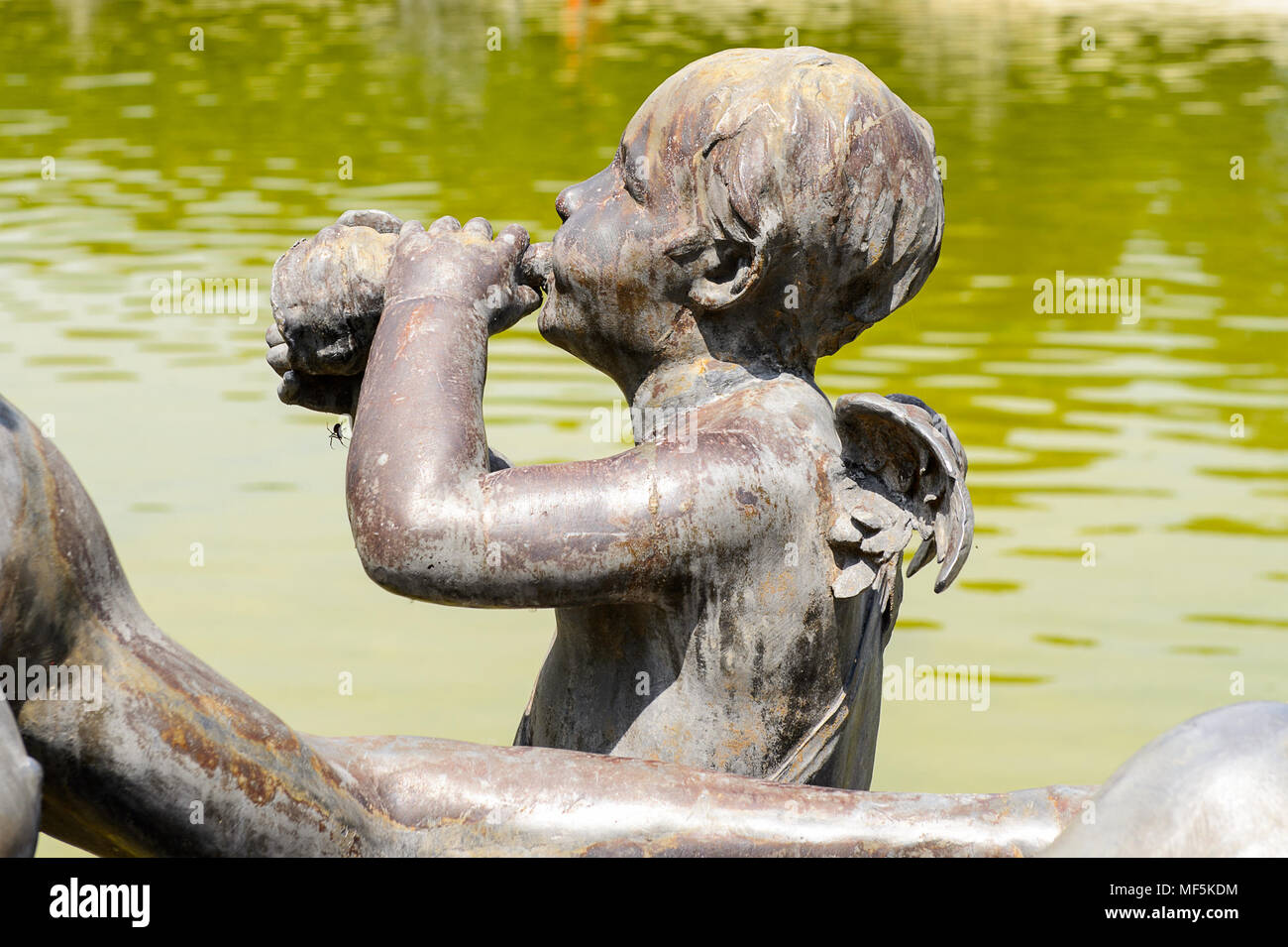 Statue of the fountain in front of the Herrenchiemsee Palace , one of ...