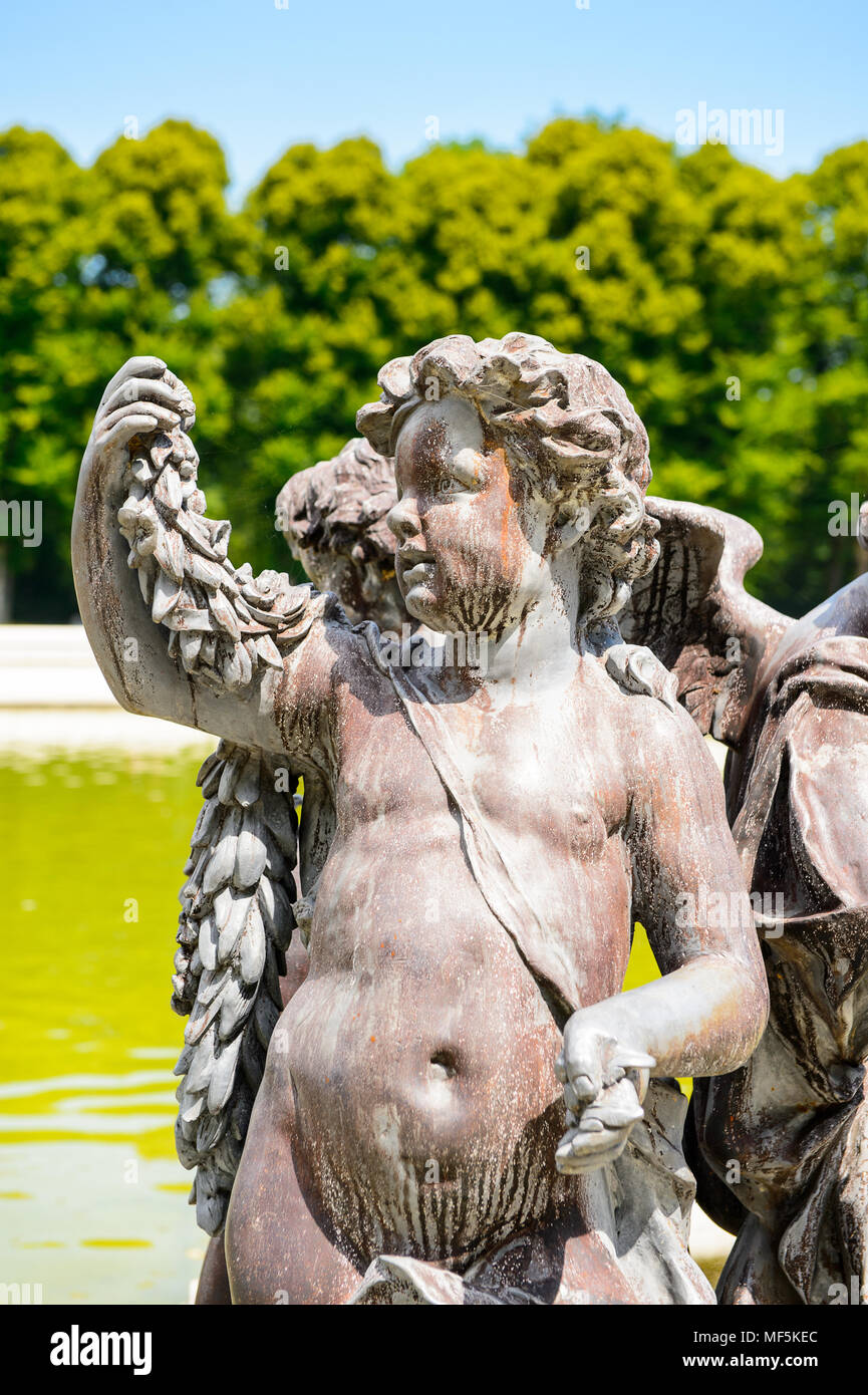 Statue of the fountain in front of the Herrenchiemsee Palace , one of ...