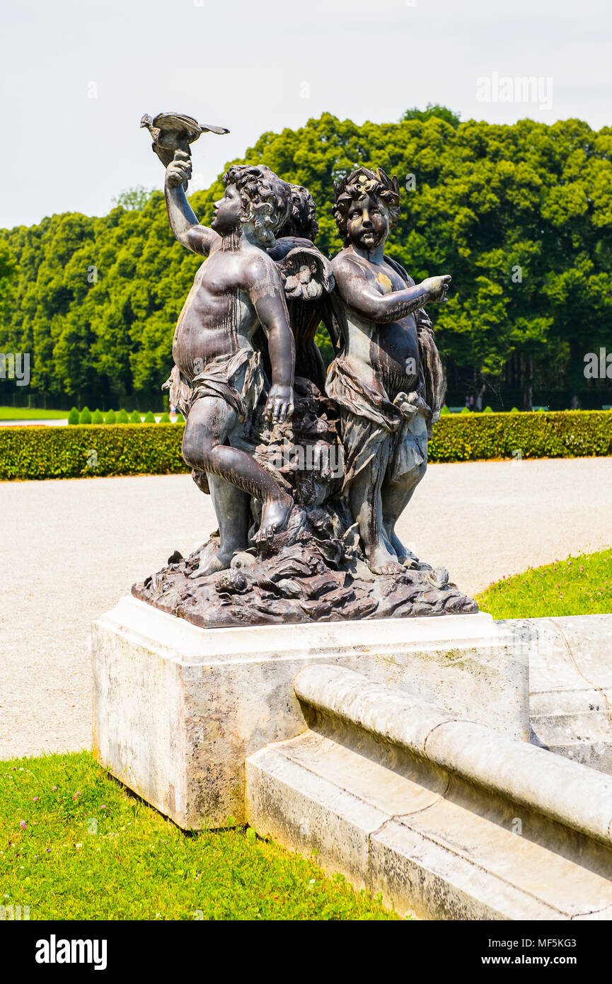 Statue of the fountain in front of the Herrenchiemsee Palace , one of ...