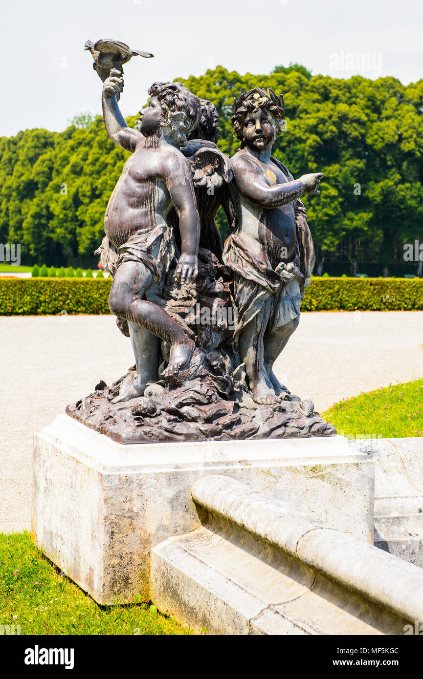Statue of the fountain in front of the Herrenchiemsee Palace , one of ...