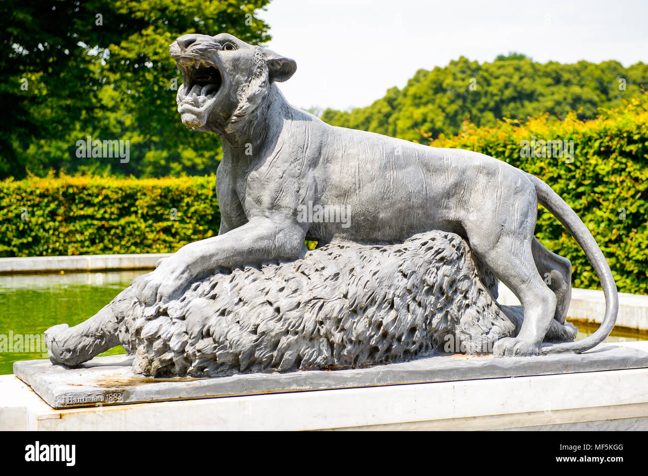Statue of the fountain in front of the Herrenchiemsee Palace , one of ...