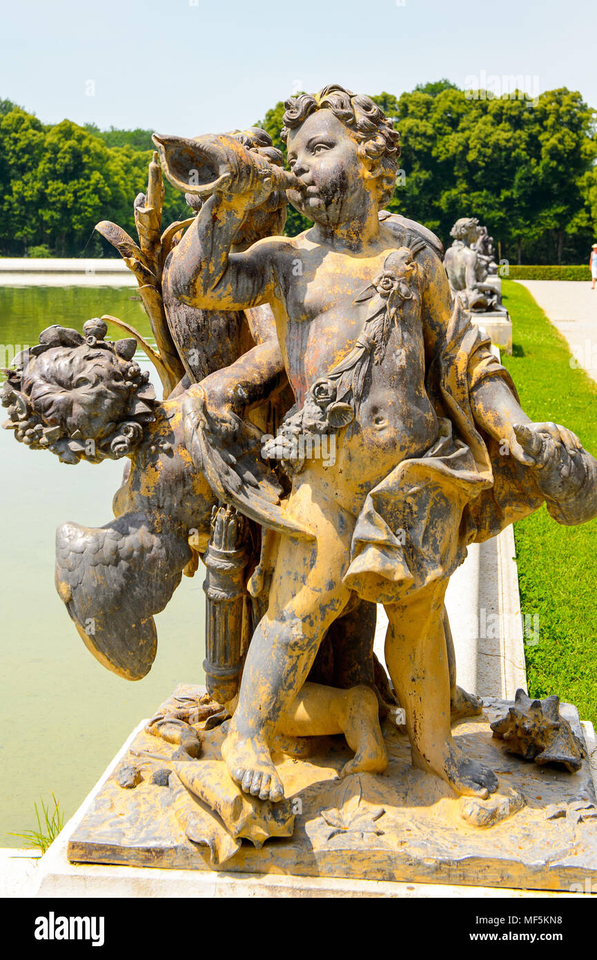 Statue of the fountain in front of the Herrenchiemsee Palace , one of ...