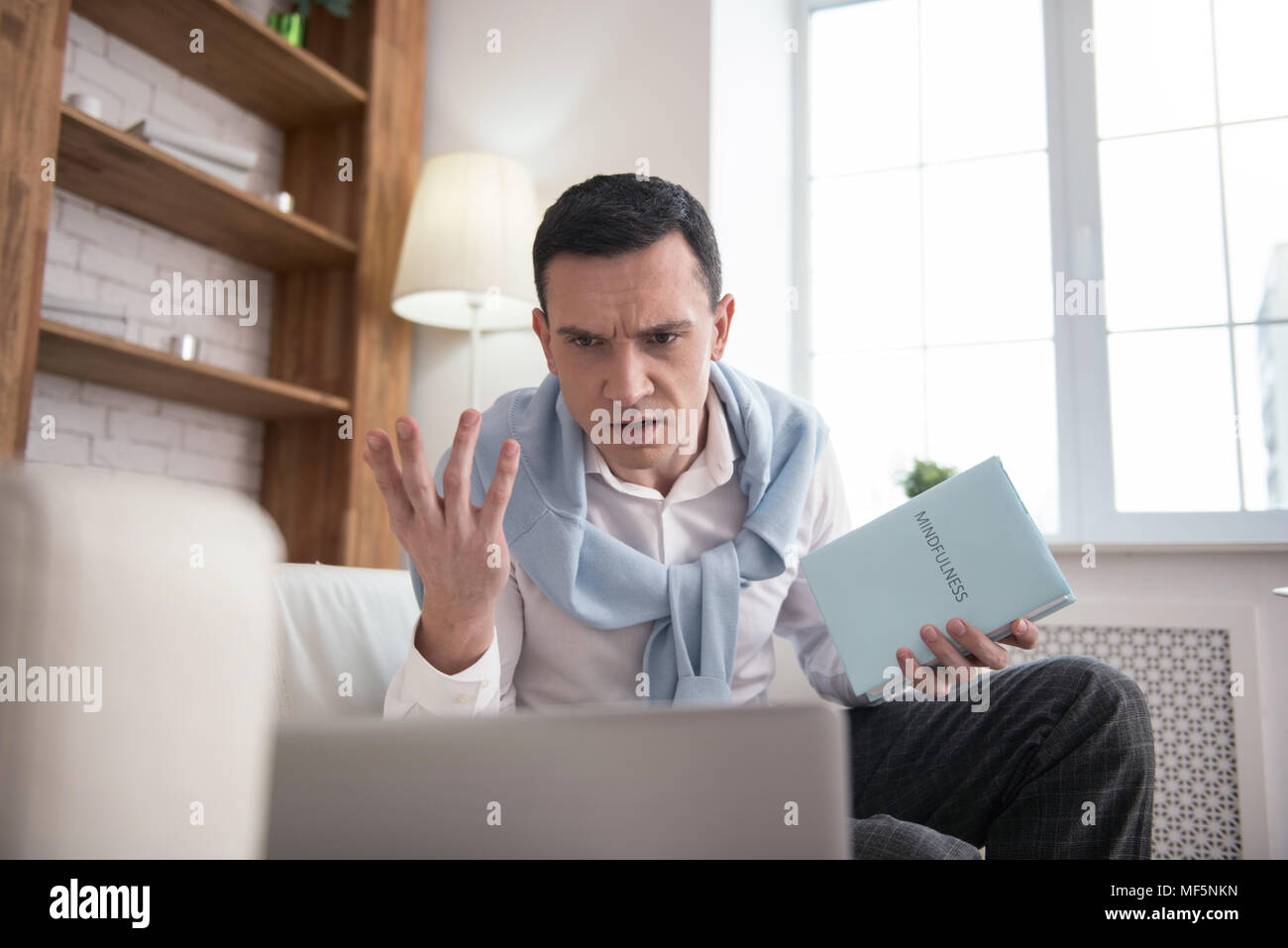 Mad displeased man receiving email Stock Photo - Alamy