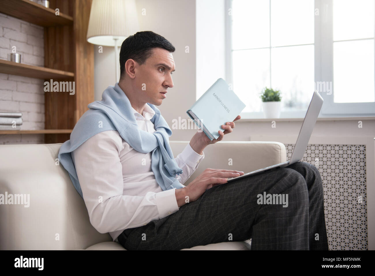 Nervous anxious man distracting from reading Stock Photo - Alamy