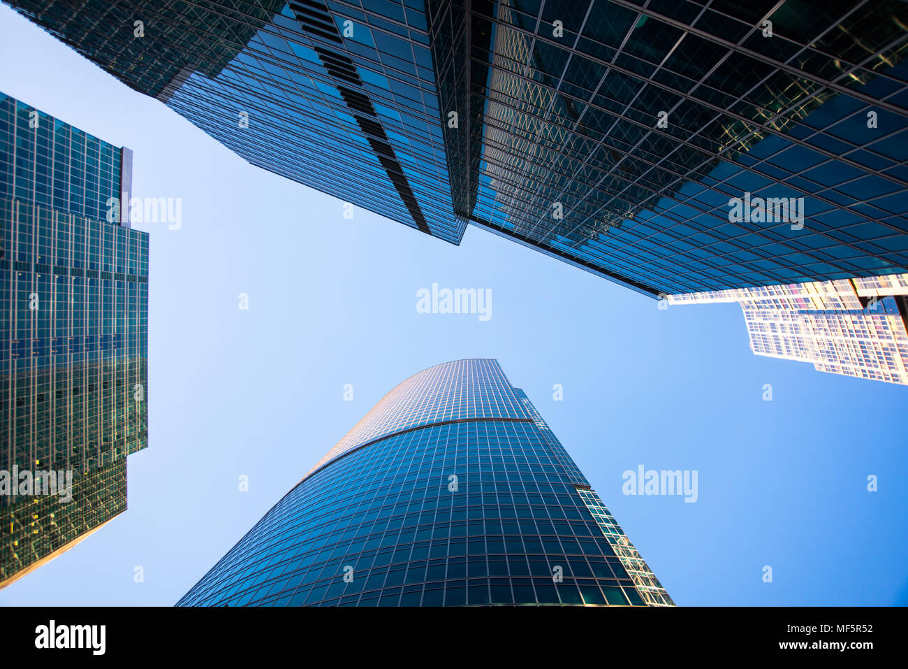 Perspective low angle view of modern glass skyscrapers facades Stock ...