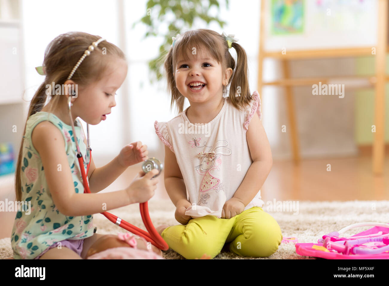 Children playing doctor Stock Photo - Alamy