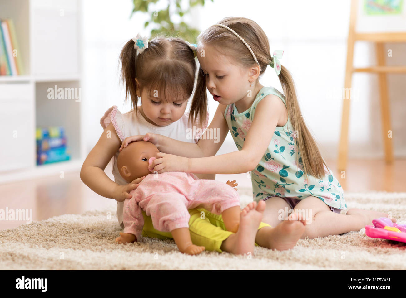 Little Girls Playing With Dolls