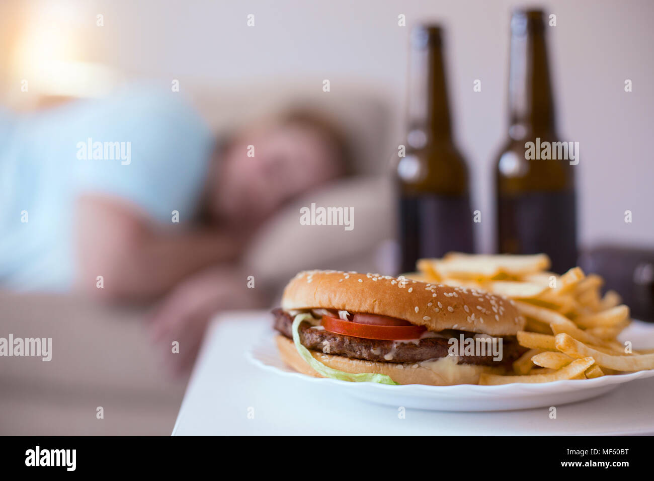 Greasy junk food disaster going around Stock Photo - Alamy