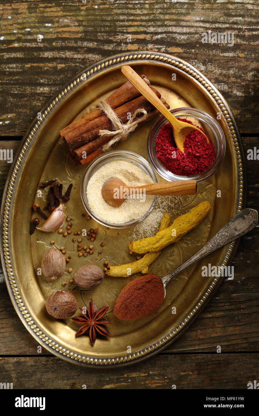 Different aromatic spices on platter Stock Photo - Alamy