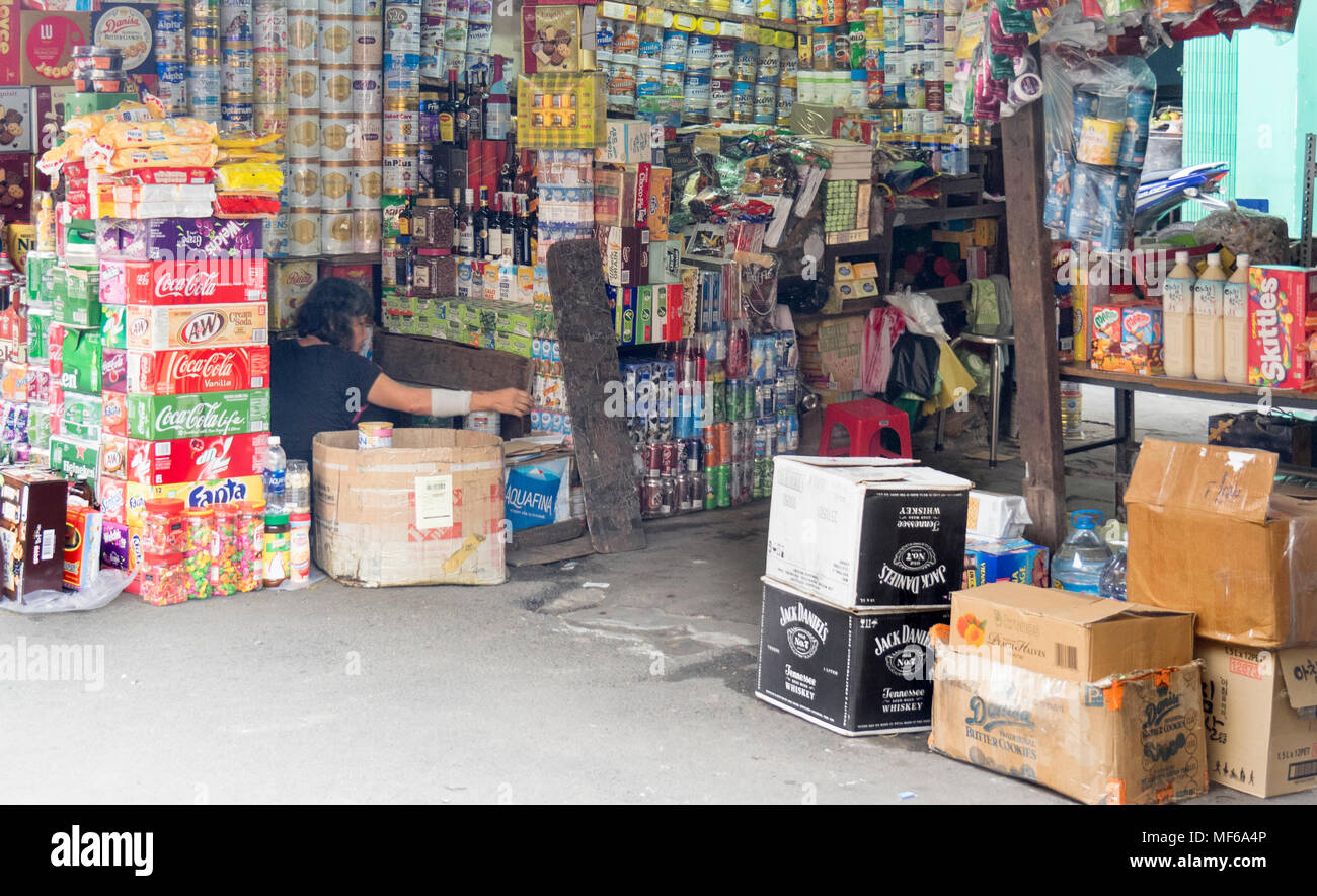 A female shopkeeper in a market stall in the Ton That Dam Street ...
