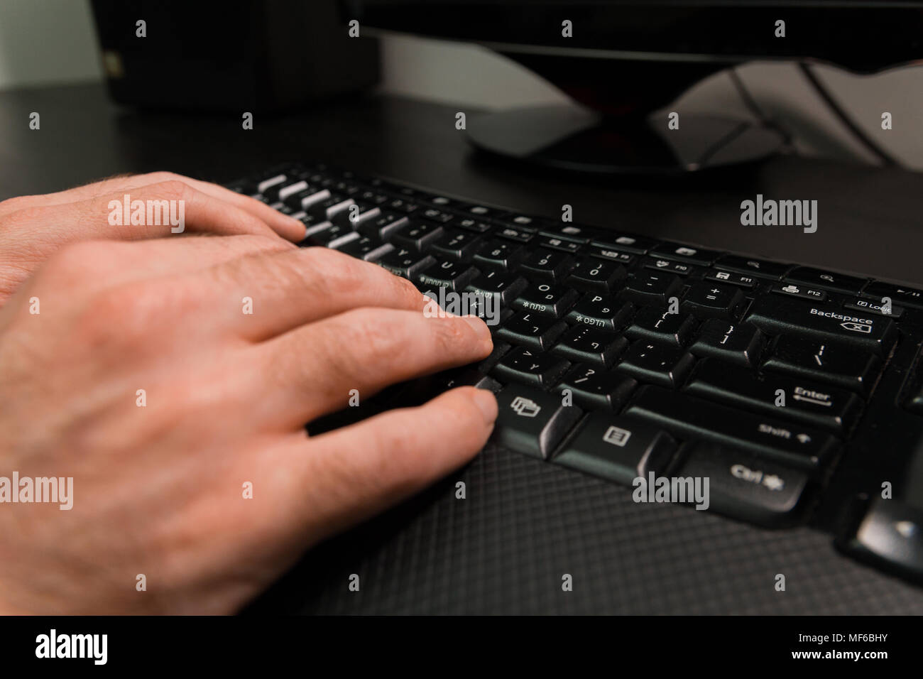 Man typing on keyboard letters hi-res stock photography and images - Alamy