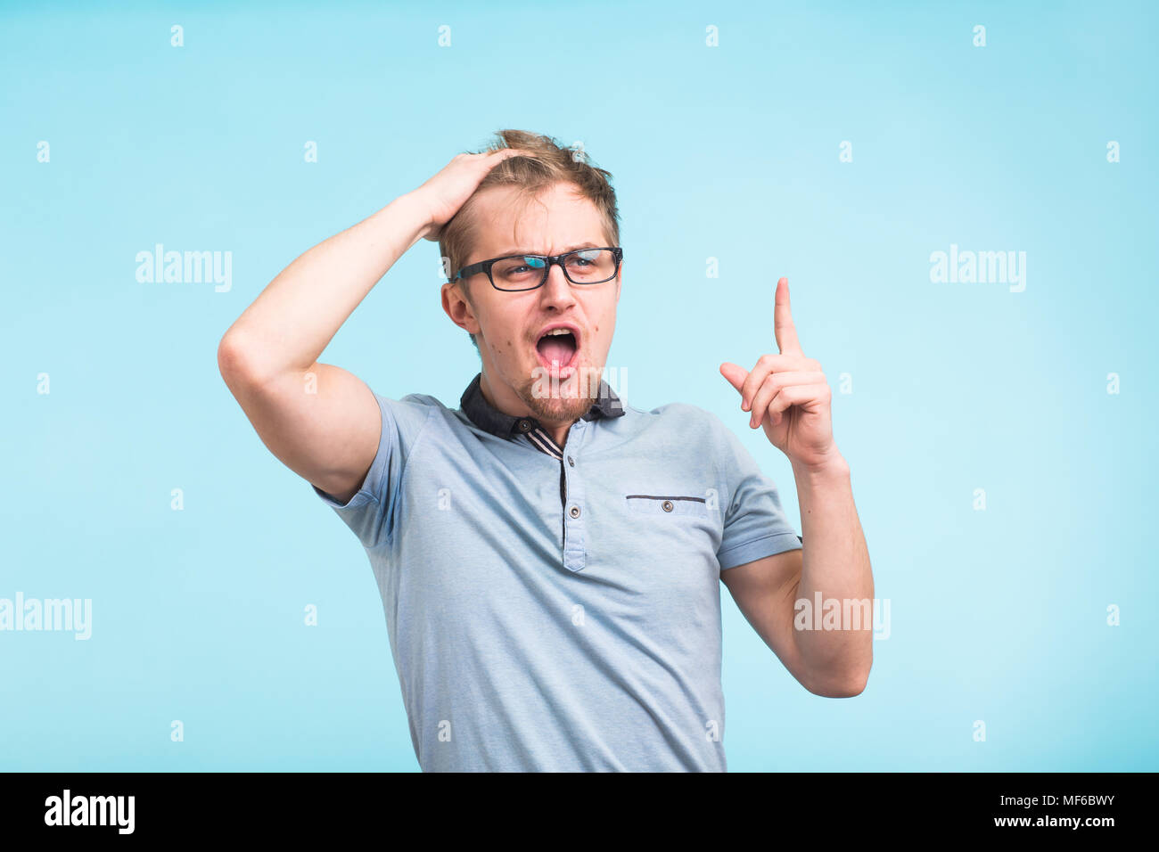 portrait of shocked stunned surprised young man eyes and mouth wide ...