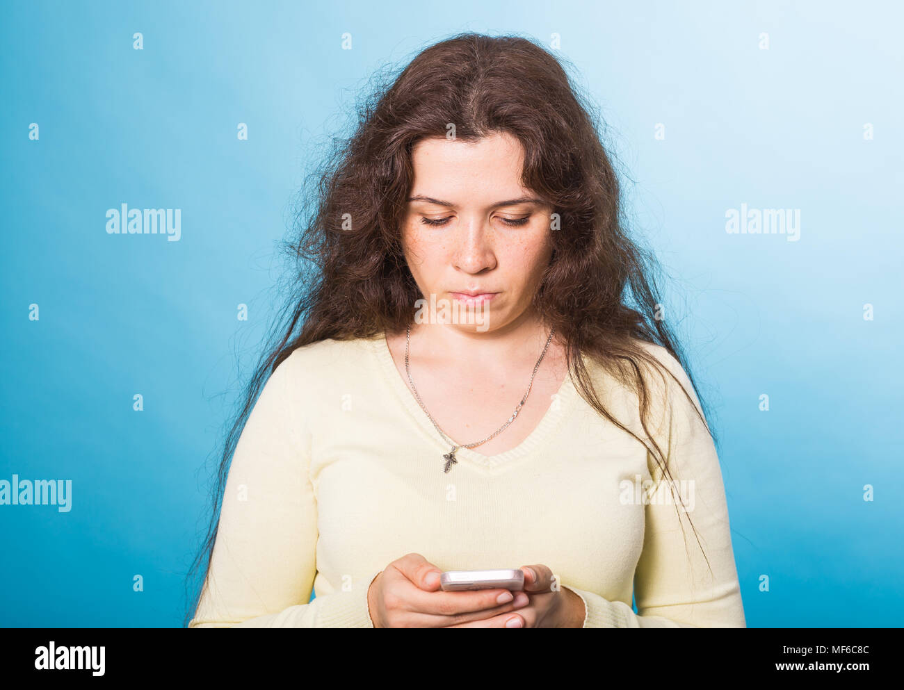 Beautiful Girl Texting on an Isolated Bacground Stock Photo - Alamy