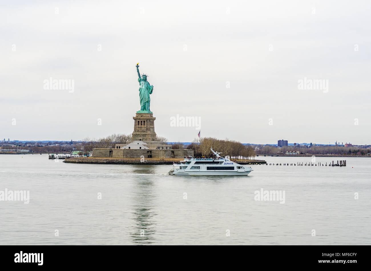 Statue of liberty in the evening, New York with reflection Stock Photo ...